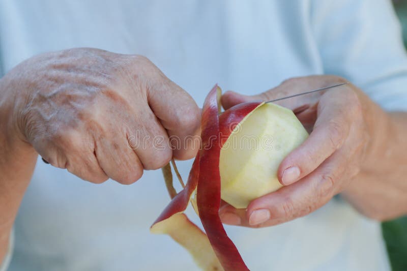 Hand peeling red apple stock image. Image of meal, health - 320223087