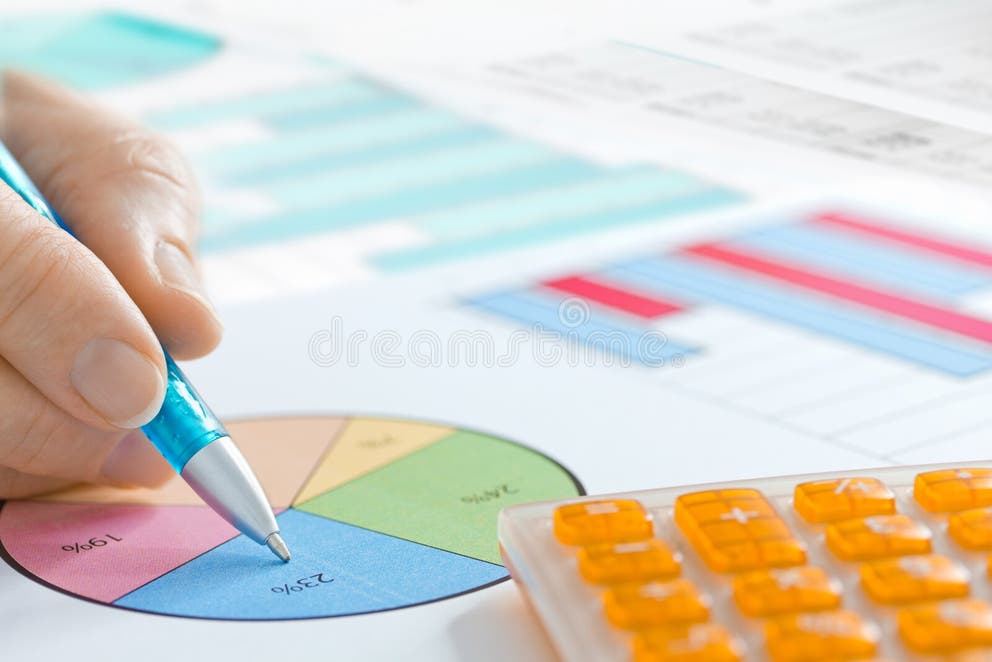 Hand with Pen and Calculator Analyzing Piechart Stock Image - Image of ...