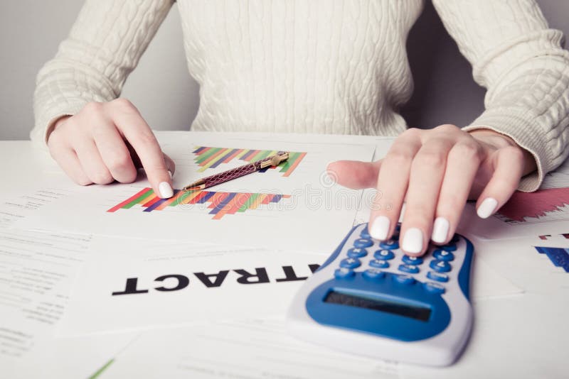 Hand with Pen, Calculator, Sheet and Graph Stock Photo - Image of ...