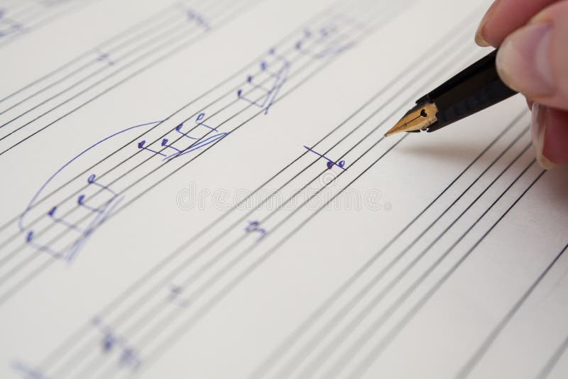 Hand with Pen and Music Sheet Stock Image - Image of melody, note: 38901563