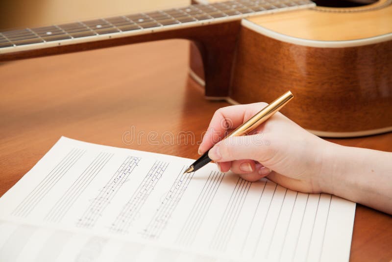 Hand with Pen and Music Sheet Stock Photo - Image of line, composition ...