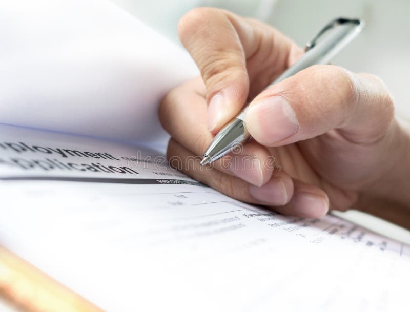 Hand with Pen Over Application Form Stock Photo - Image of business ...