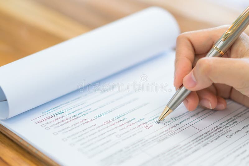Hand with Pen Over Application Form . Stock Photo - Image of choice ...