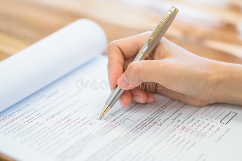 Hand with Pen Over Application Form . Stock Image - Image of solution ...