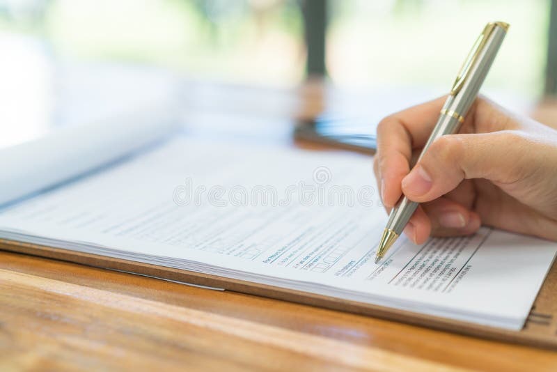 Hand with Pen Over Application Form . Stock Photo - Image of ...