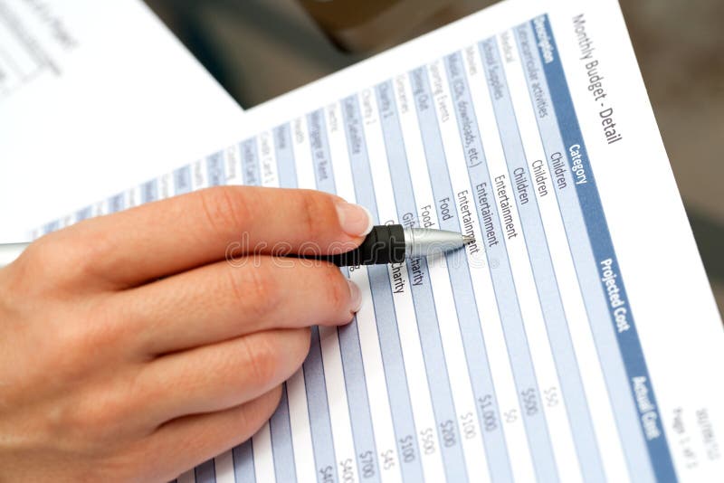 Hand with Pen Pointing on Financial Document. Stock Image - Image of ...