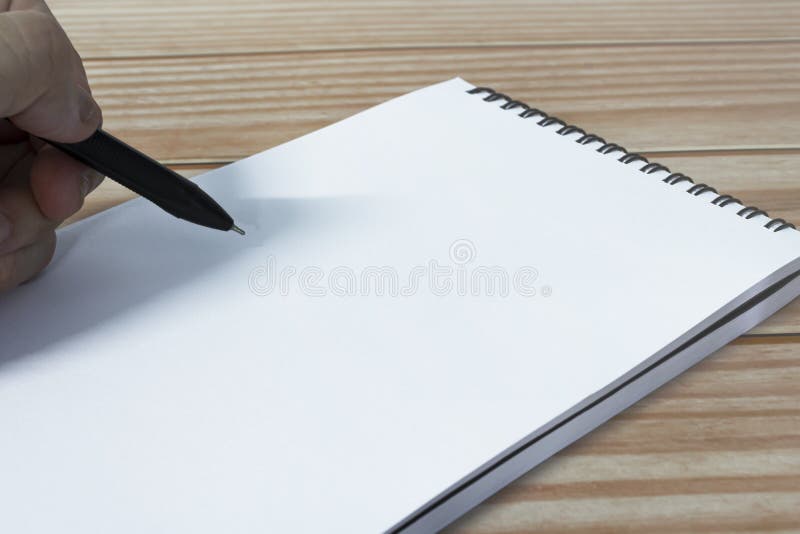 Hand with Pen Writing Notebook on Office Desk Table with. Copy Space ...