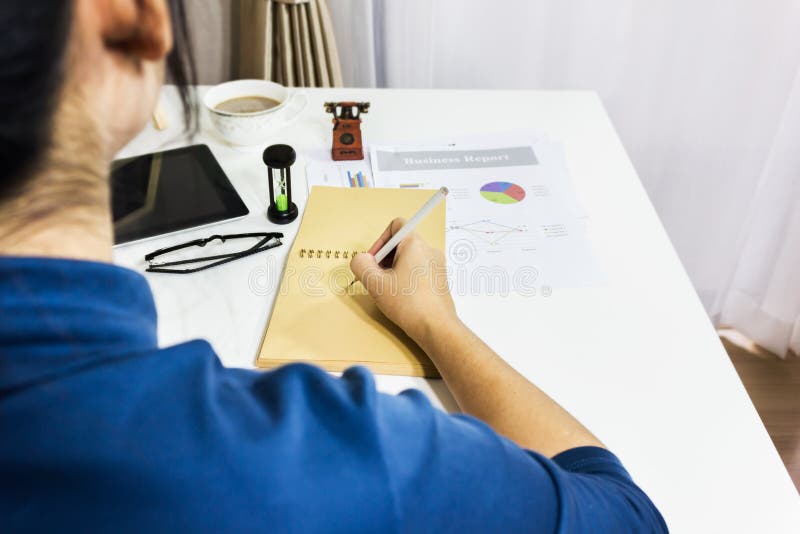 Hand with Pencil, Writing Down on Blank Note Book on Working Tab Stock ...