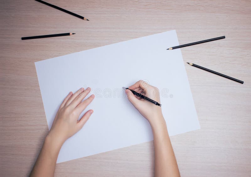 Hand with Pencil Writing on White Paper Sheet Stock Image - Image of ...