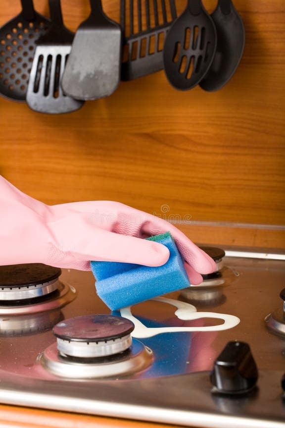 Hand of the Person Cleans a Cooker Stock Photo - Image of cleans, goods ...