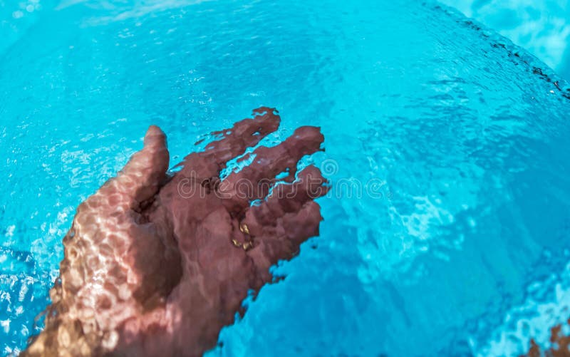 Hand of a Person in the Crystal Blue Water of a Pool Stock Photo ...