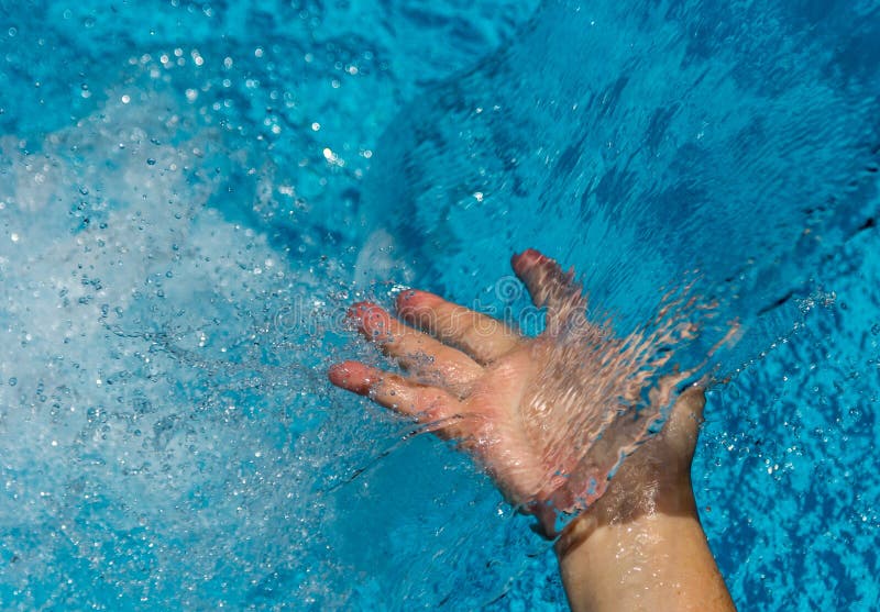 Hand of a Person in the Crystal Blue Water of a Pool Stock Photo ...