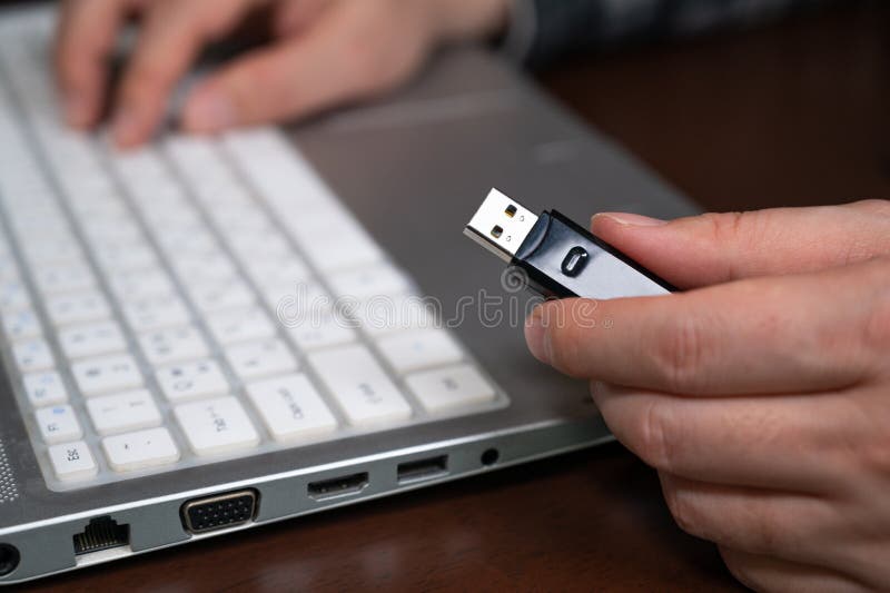The Hand of a Person Using a USB Memory. Cyber Information Protection ...