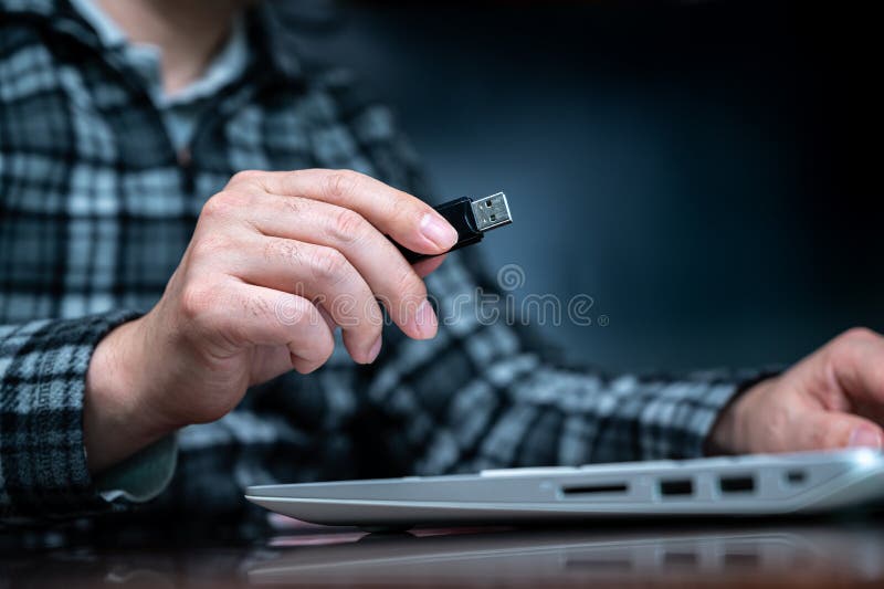 The Hand of a Person Using a USB Memory. Cyber Information Protection ...