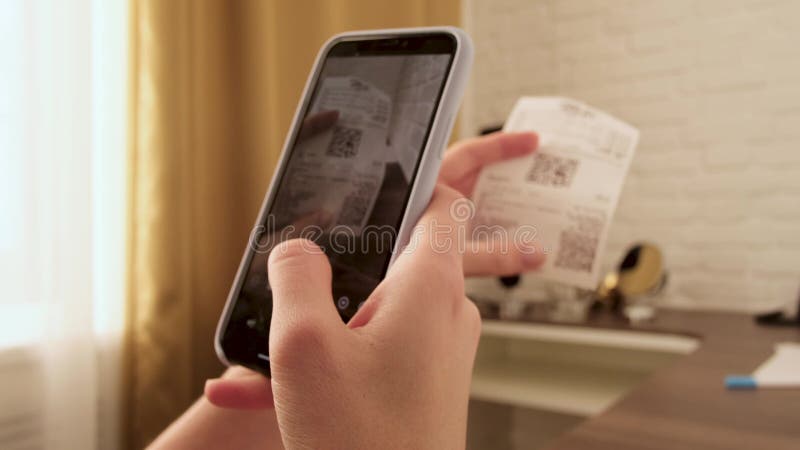 A Man Scans the QR Code of a Plastic Product Package by Scan App of ... A Man Scans the QR Code of a Plastic Product Package by Scan App of ...
