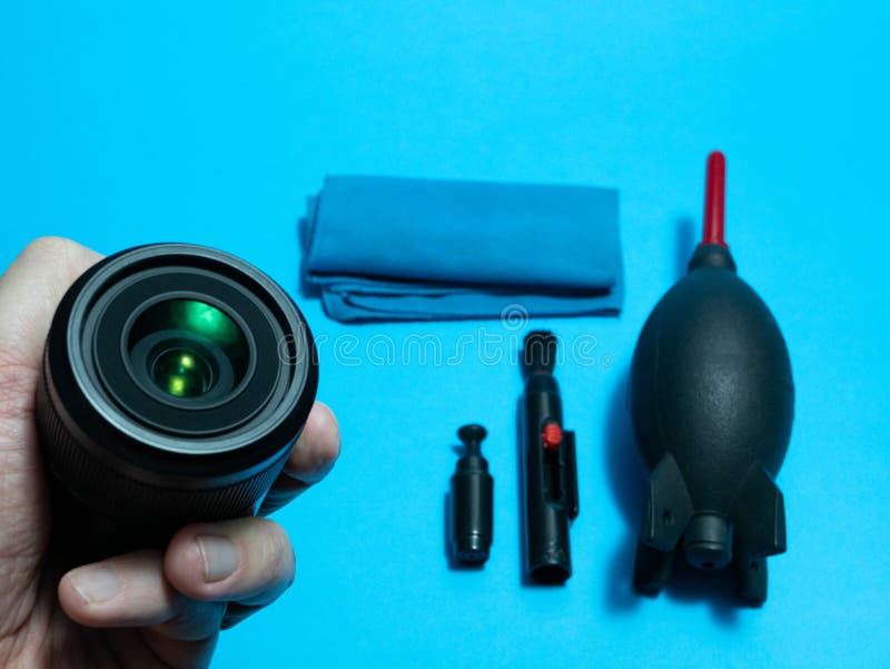 Hand with Photography Lens and Cleaning Tools Stock Photo - Image of ...