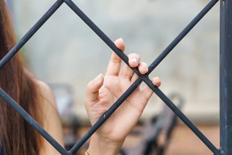 The hand pick the cage stock image. Image of freedom - 78132673