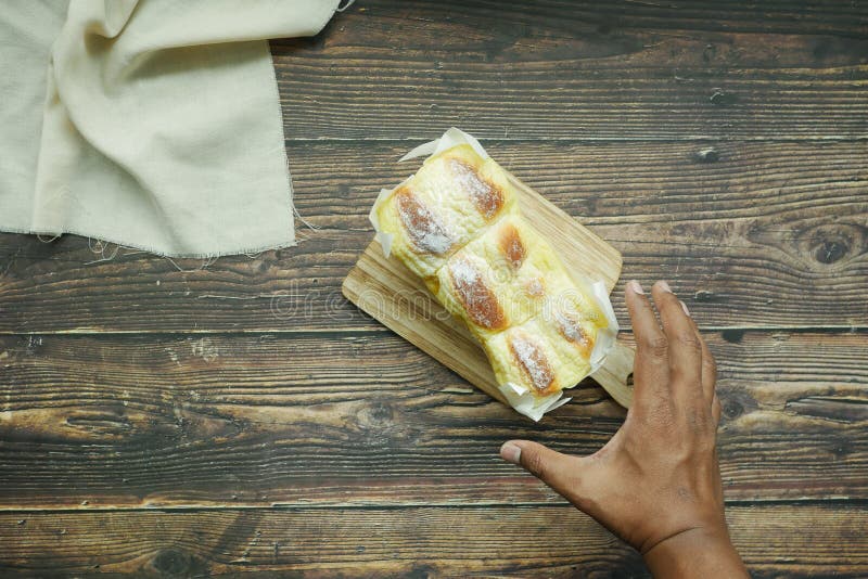 Hand Pick a Cream Butter Bread from a Table Stock Image - Image of ...