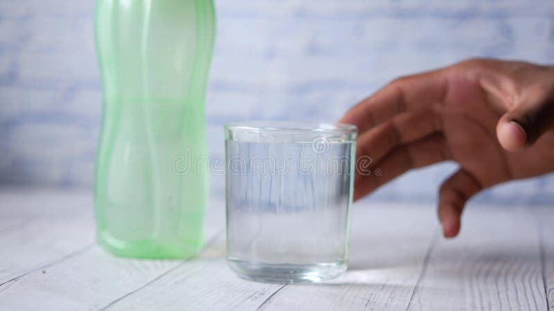Hand Pick a Glass of Water on Table Stock Footage - Video of drinking ...
