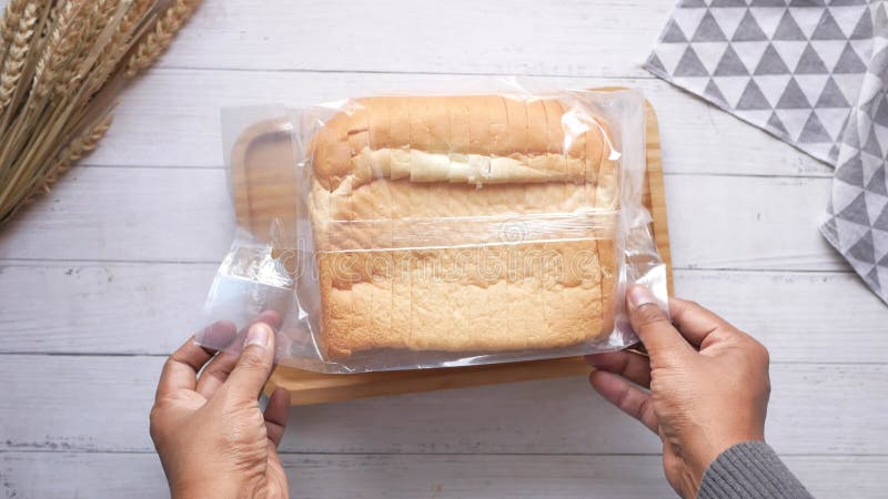 Hand Pick a Packet of Bread on Table Stock Video - Video of hand ...