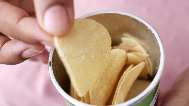 Hand Pick Potato Chips from a Container Stock Video - Video of calorie ...