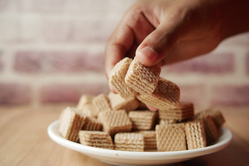 Hand Pick a Small Cube Shape Wafer Roll Chocolate Stock Photo - Image ...