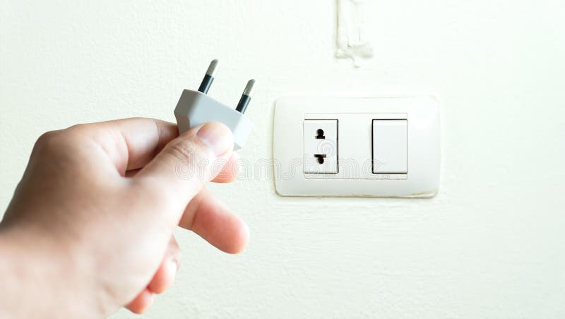 A Hand Pick Up Two Pin Electrical Plug. Stock Image - Image of ...