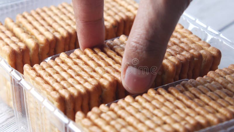 Hand Pick a Whole Wheat Cracker on Table , Stock Footage - Video of ...