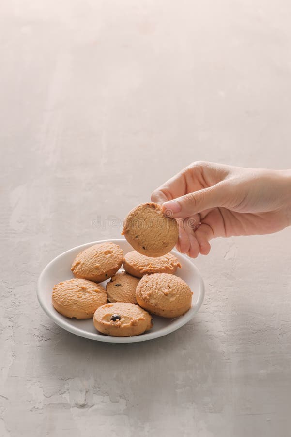 Hand Picking Cookie from Plate. Stock Image - Image of closeup, fresh ...