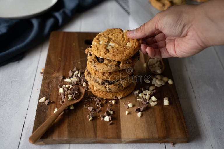 Hand Picking a Cookie from a Stack Stock Image - Image of pastry, snack ...