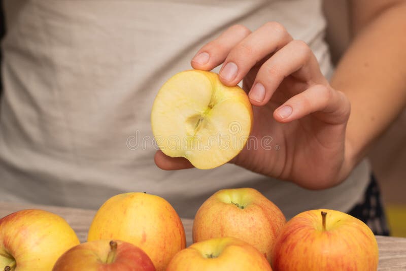Hand Picking a Fresh Apple. Female Hand Holding Fresh Ripe Apple Stock ...