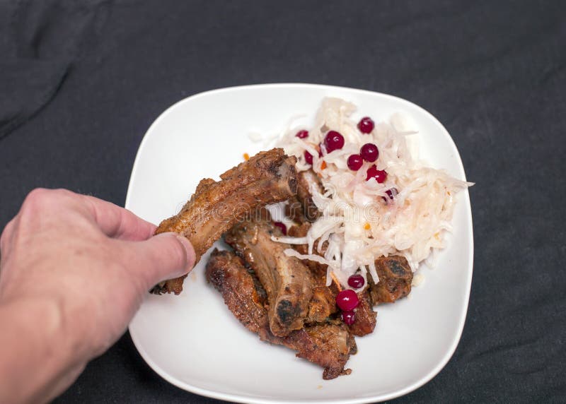 Hand picking fried ribs stock image. Image of food, pork - 314240891