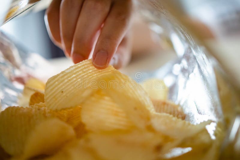 Hand Picking Potato Chips Inside Snack Bag Stock Image - Image of ...