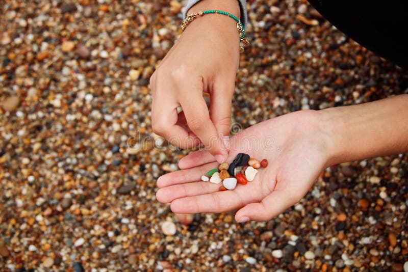 Hand picking some stones. stock photo. Image of healthcare - 152869390