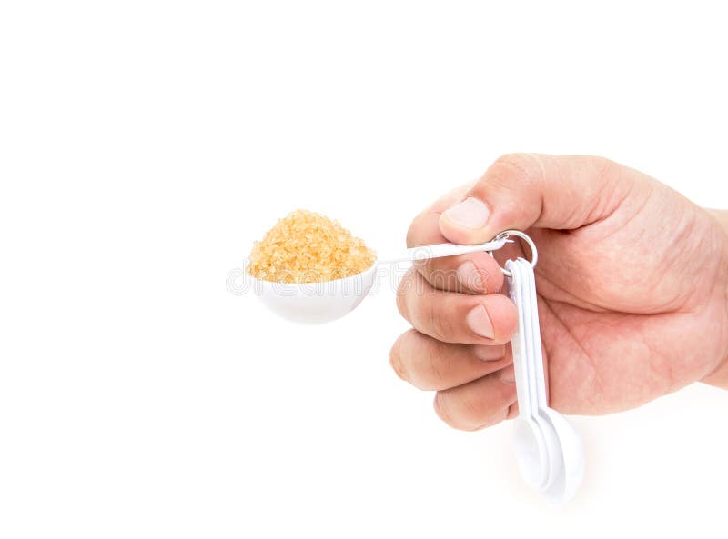 Hand Picking Up Brown Sugar with Measuring Spoon Stock Image - Image of ...