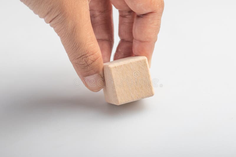 Hand Picking Up Empty Wooden Square Blocks on White Background Stock ...