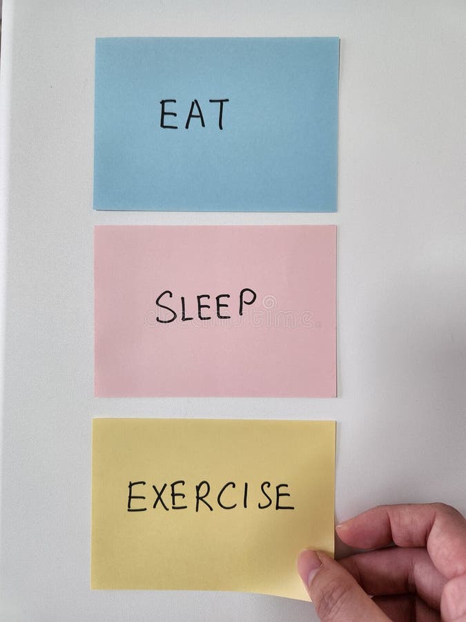 Hand Picking Up a Note with the Word Exercise. EAT, SLEEP, EXERCISE ...