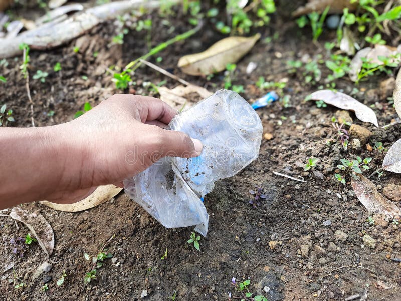 Hand Picking Up Plastic Waste for Clean Environment Stock Photo - Image ...