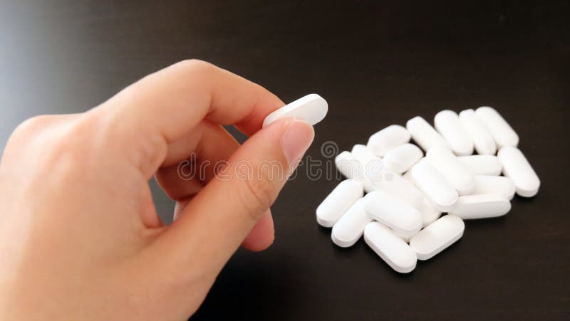 Hand Picking Up White Supplement Tablet Stock Photos - Free & Royalty ...