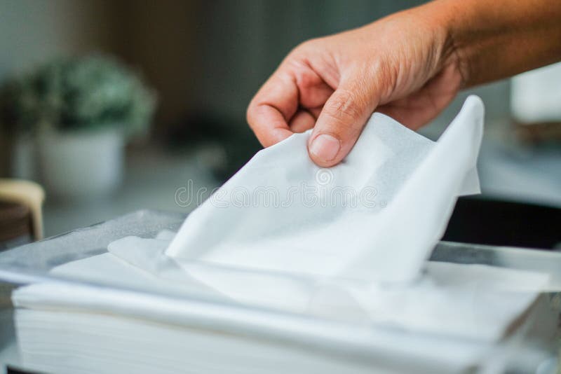 Hand Picking White Tissue Papers from Clear Plastic Box. Stock Image ...