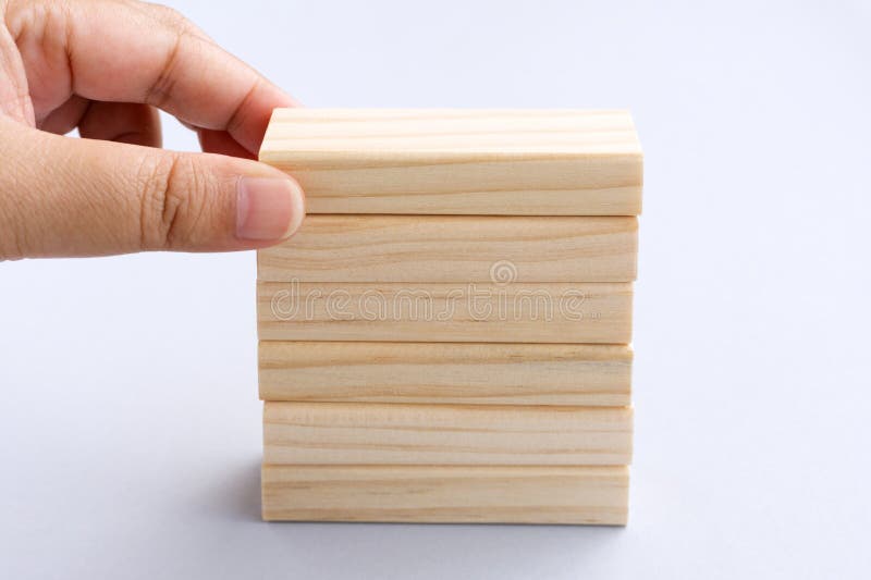 Hand Picking Wood Blocks stock image. Image of copy - 132202767