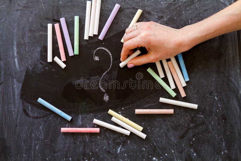 Hand with a Piece of Chalk Drawing a Question Mark Stock Image - Image ...