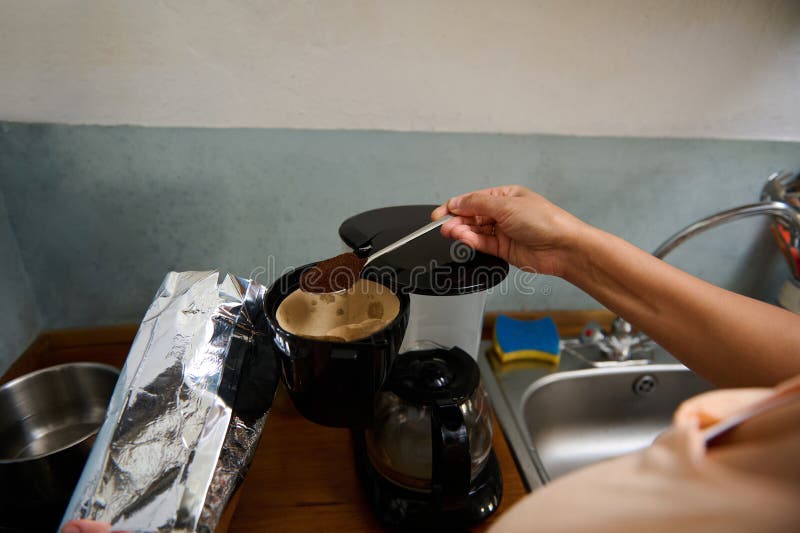 Preparing Ground Coffee in a Filter for Brewing in a Coffee Machine ...