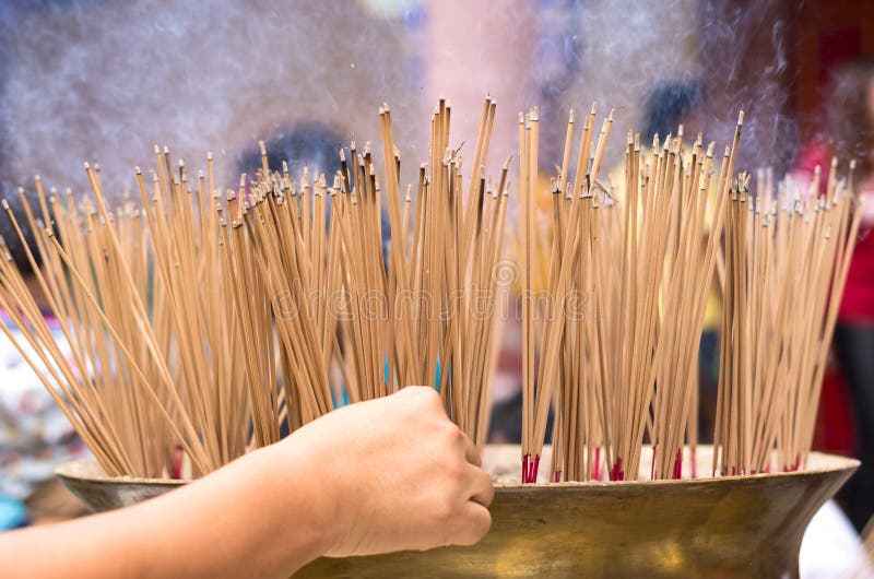 Hand Places a Stick of Incense at a Large Pot Stock Photo - Image of ...