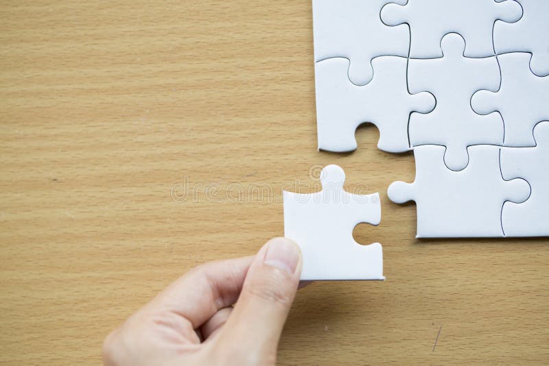 Hand Placing The Last Jigsaw Puzzle Piece,conceptual Of Problem Solving ...