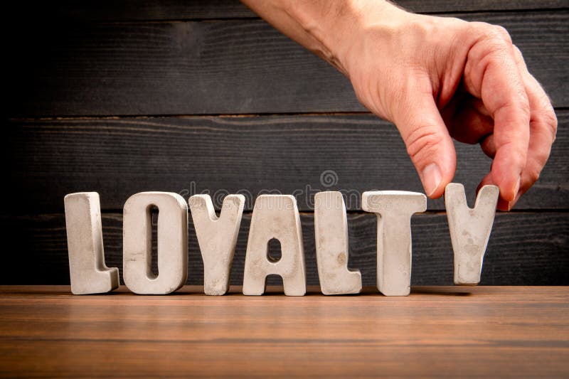 Hand Placing LOYALTY Text on Wooden Desk Stock Image - Image of ...