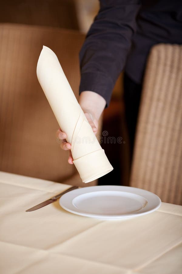 Hand Placing Napkin on Plate at Restaurant Table Stock Image - Image of ...