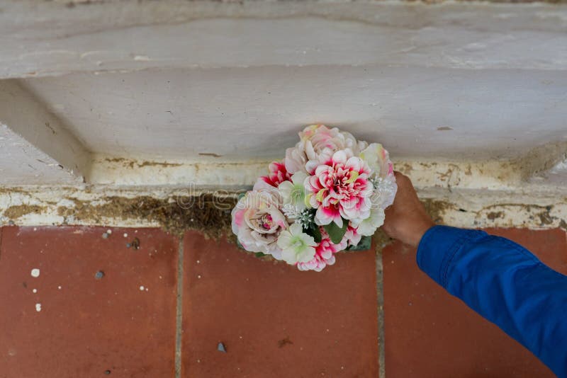 A Hand Placing Some Flowers in a Cemetery Stock Photo - Image of hand ...
