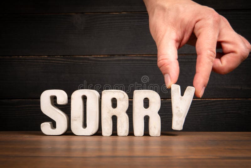 Hand Placing SORRY Text on Wooden Desk Stock Image - Image of ...