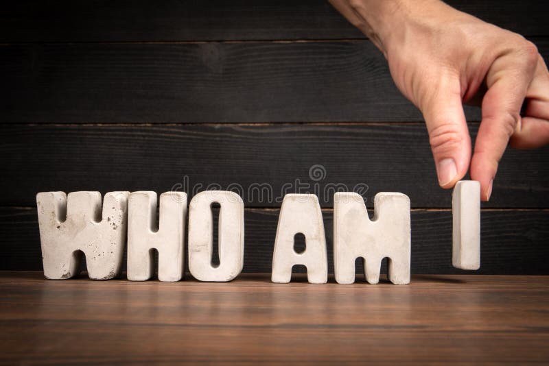 Hand Placing WHO am I Text on Wooden Desk Stock Photo - Image of ...